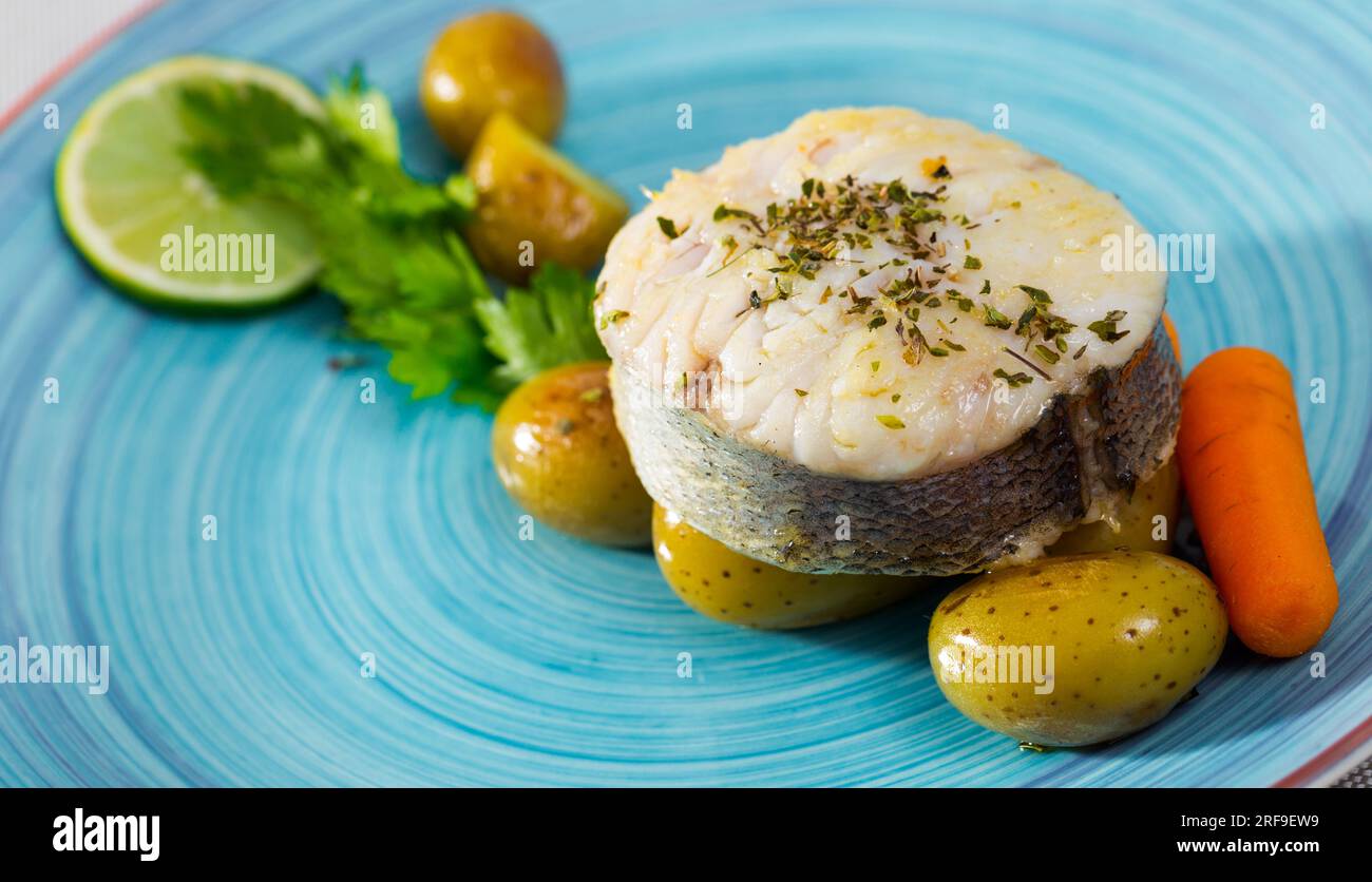 Recipe of rustic style merluccius Stock Photo - Alamy