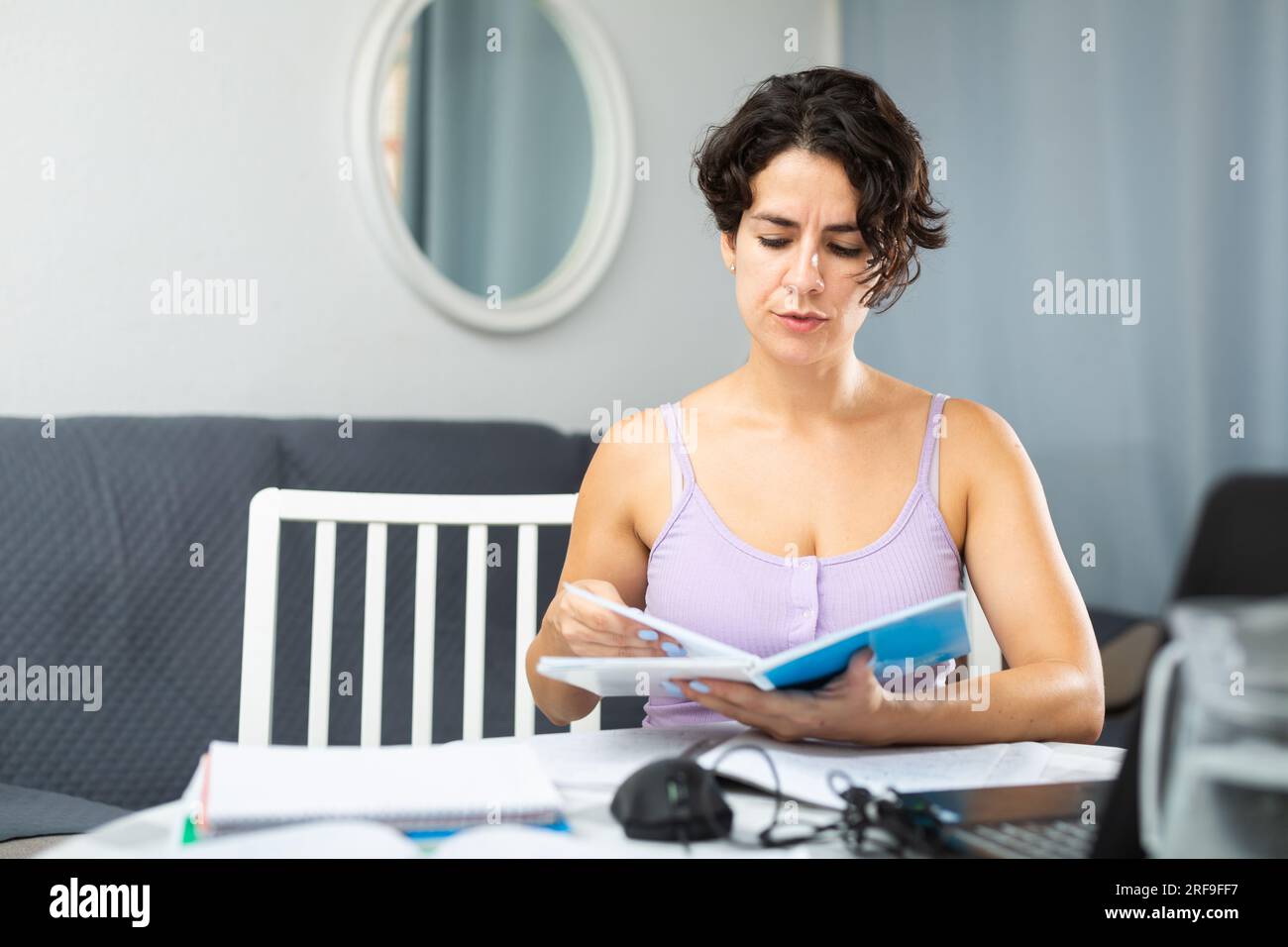 Happy female student study, reading book Stock Photo - Alamy