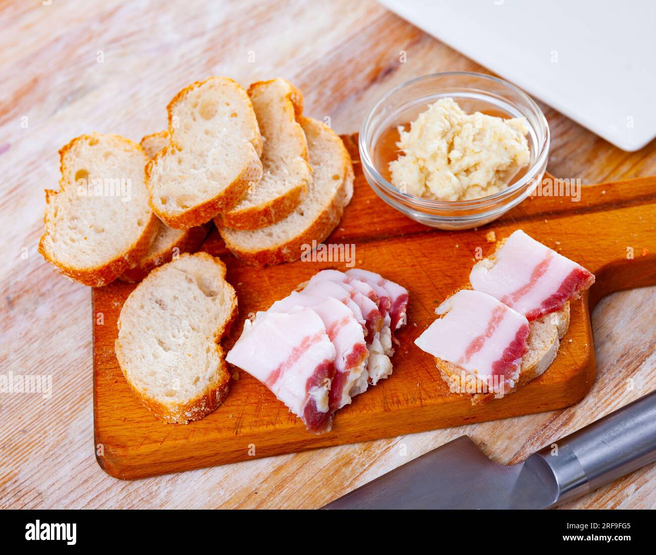 Snack for vodka, homemade salo with bread and horseradish on rustic ...
