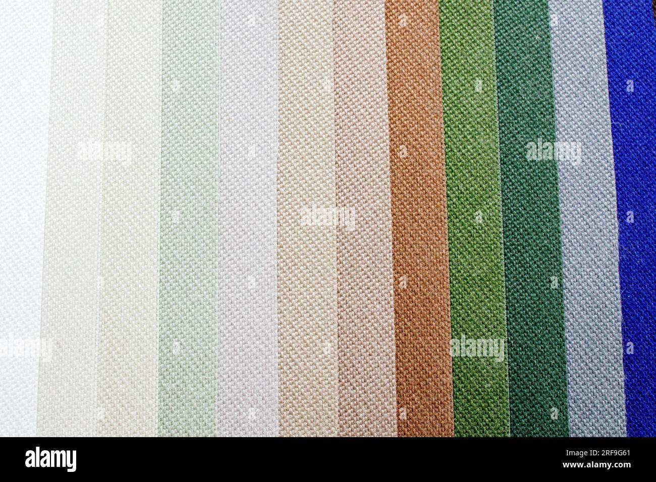 Multicolored fabric background. Variety of color of dense fabric. Color ...