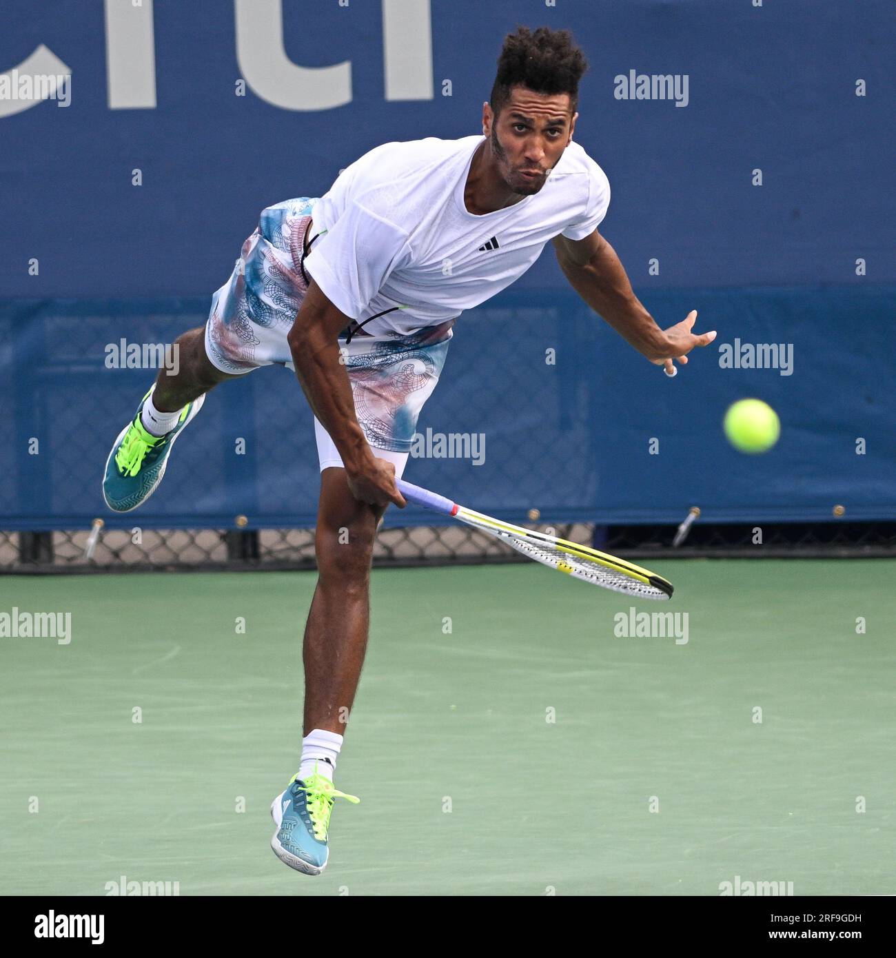 Washington, D.C, USA. 1st Aug, 2023. MICHAEL MMOH hits a serve during ...