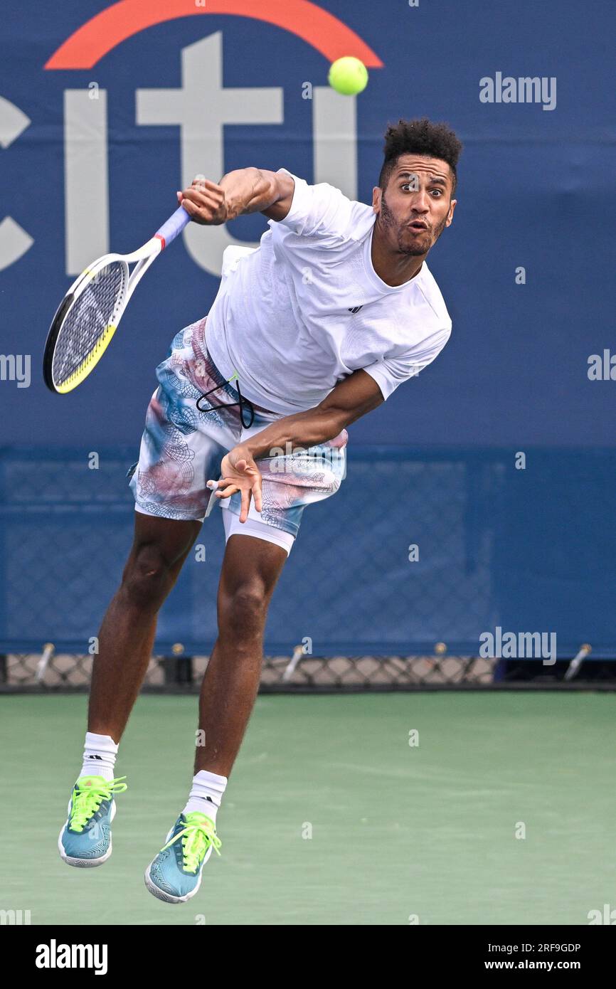 Washington, D.C, USA. 1st Aug, 2023. MICHAEL MMOH hits a serve during ...