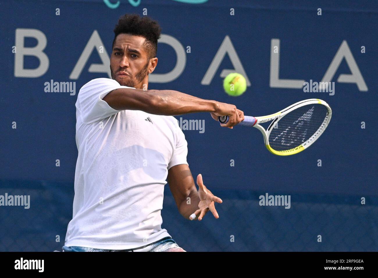 Washington, D.C, USA. 1st Aug, 2023. MICHAEL MMOHhits a serve during ...