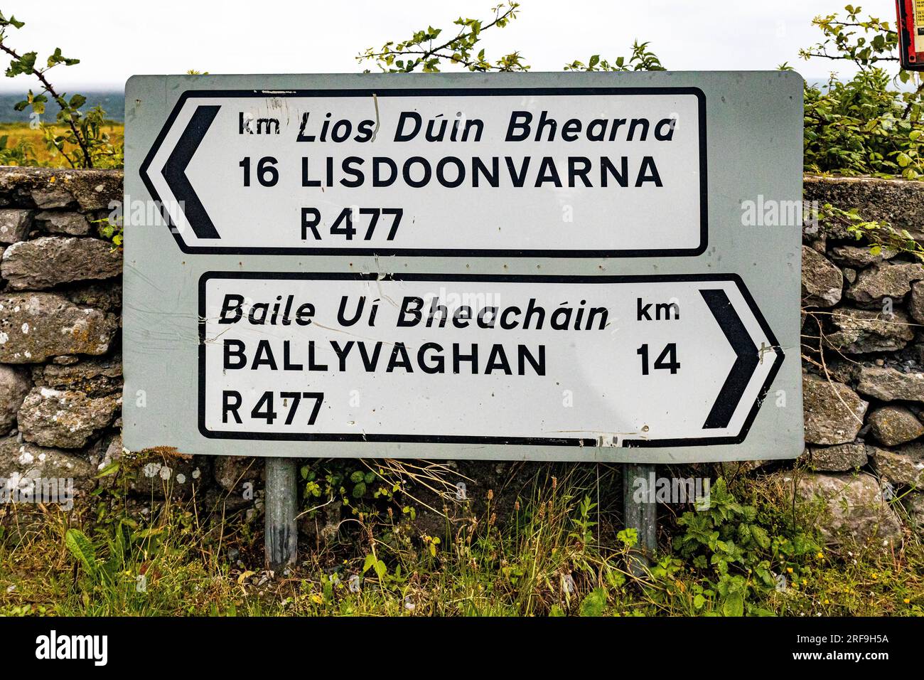 Traditional Irish road sign to Lisdoonvarna and Ballyvaghan towns ...