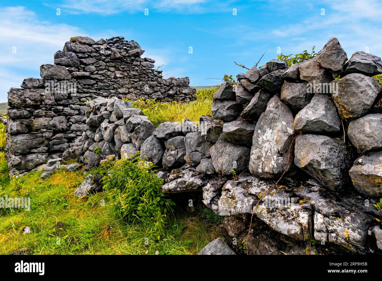 Old Irish celtic buildings stone ruins at coastline in summer Stock ...