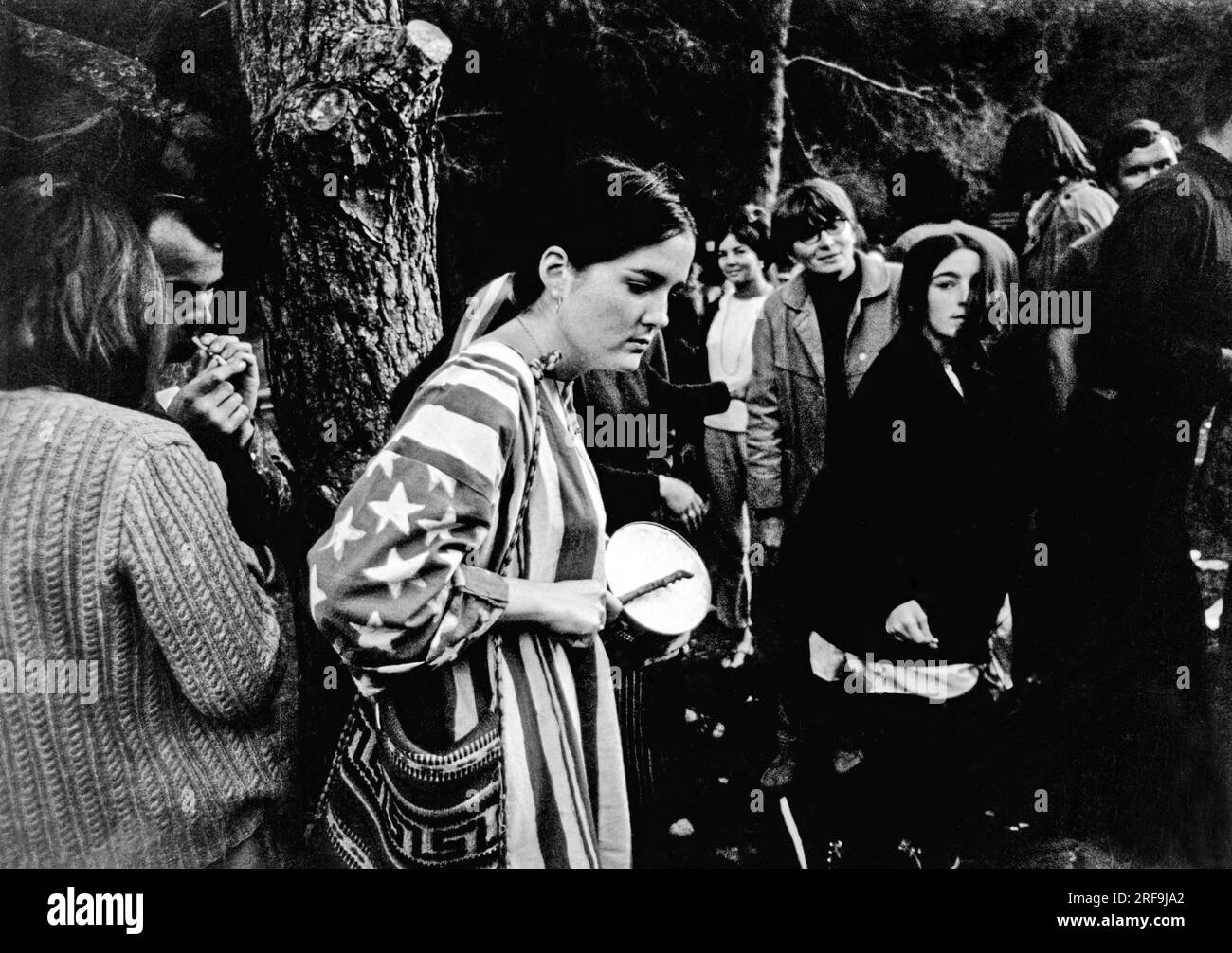 Los Angeles, California: 1968. A woman plays a drum with protesters at ...