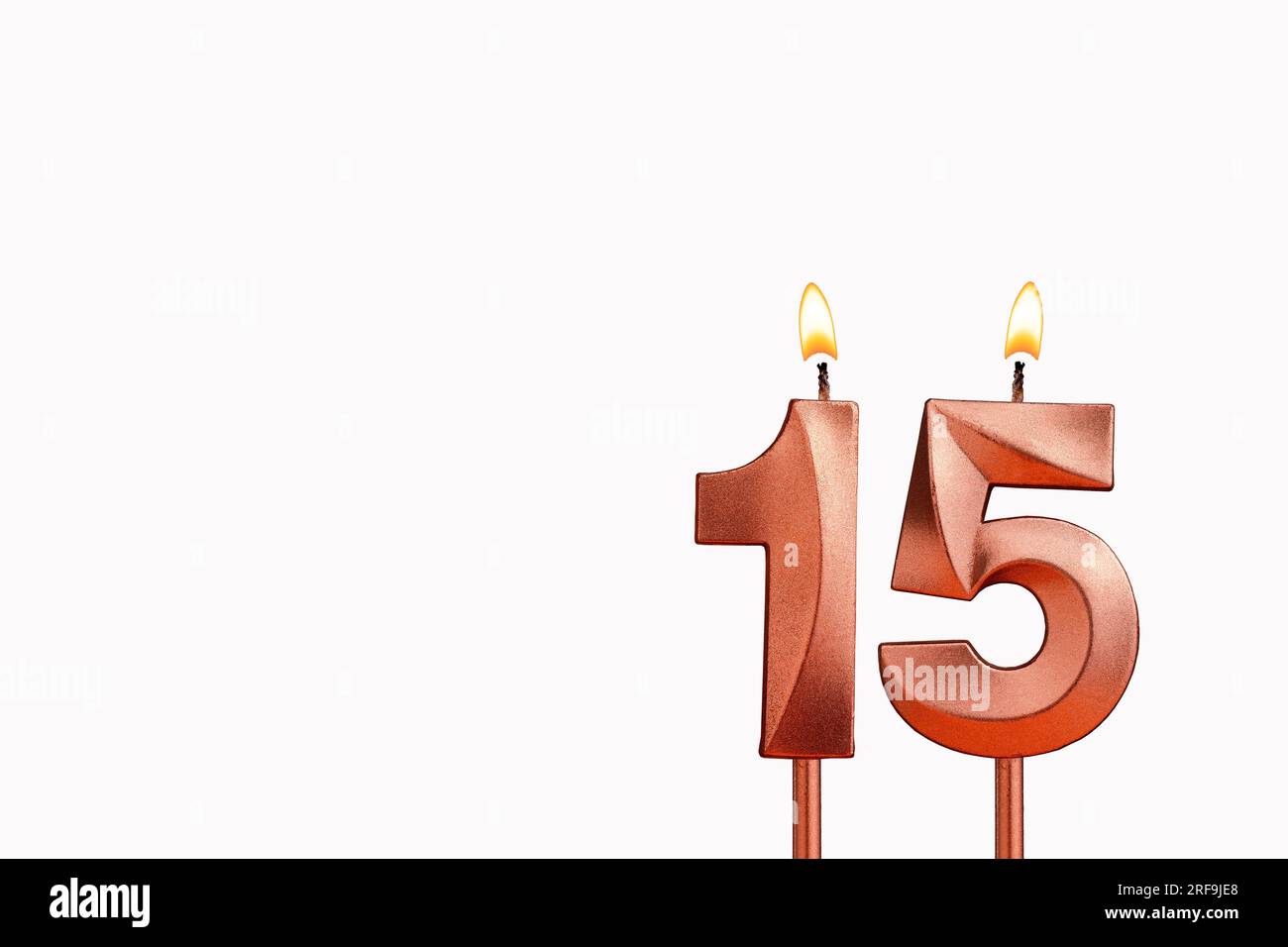 Birthday candle number 15 on white background Stock Photo - Alamy