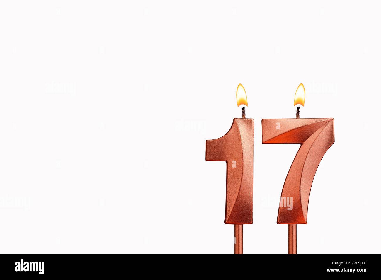 Birthday candle number 17 on white background Stock Photo - Alamy