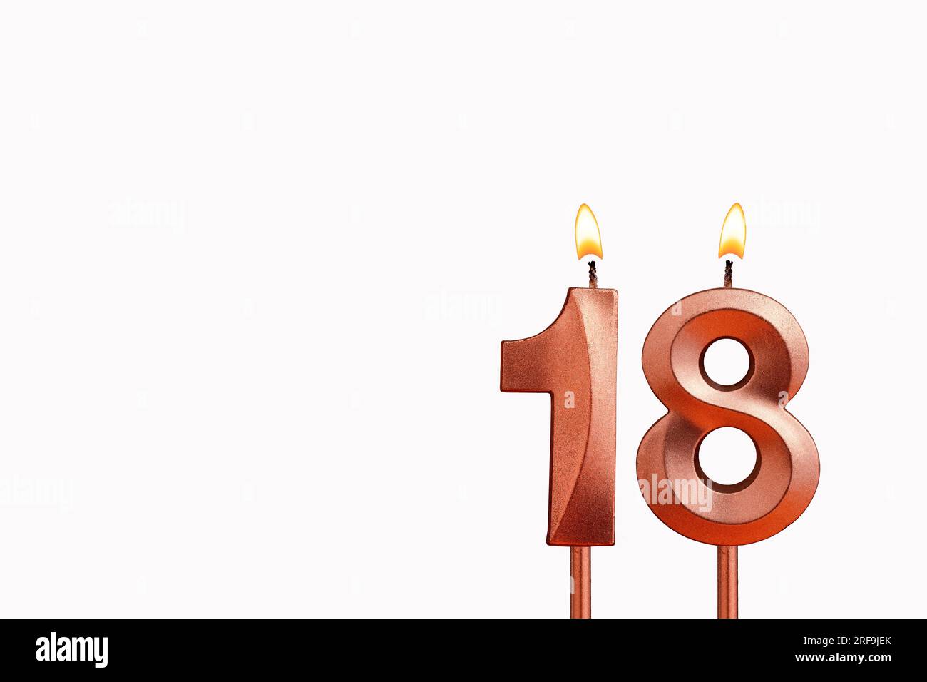 Burning candle number 18 for birthday on white background Stock Photo ...