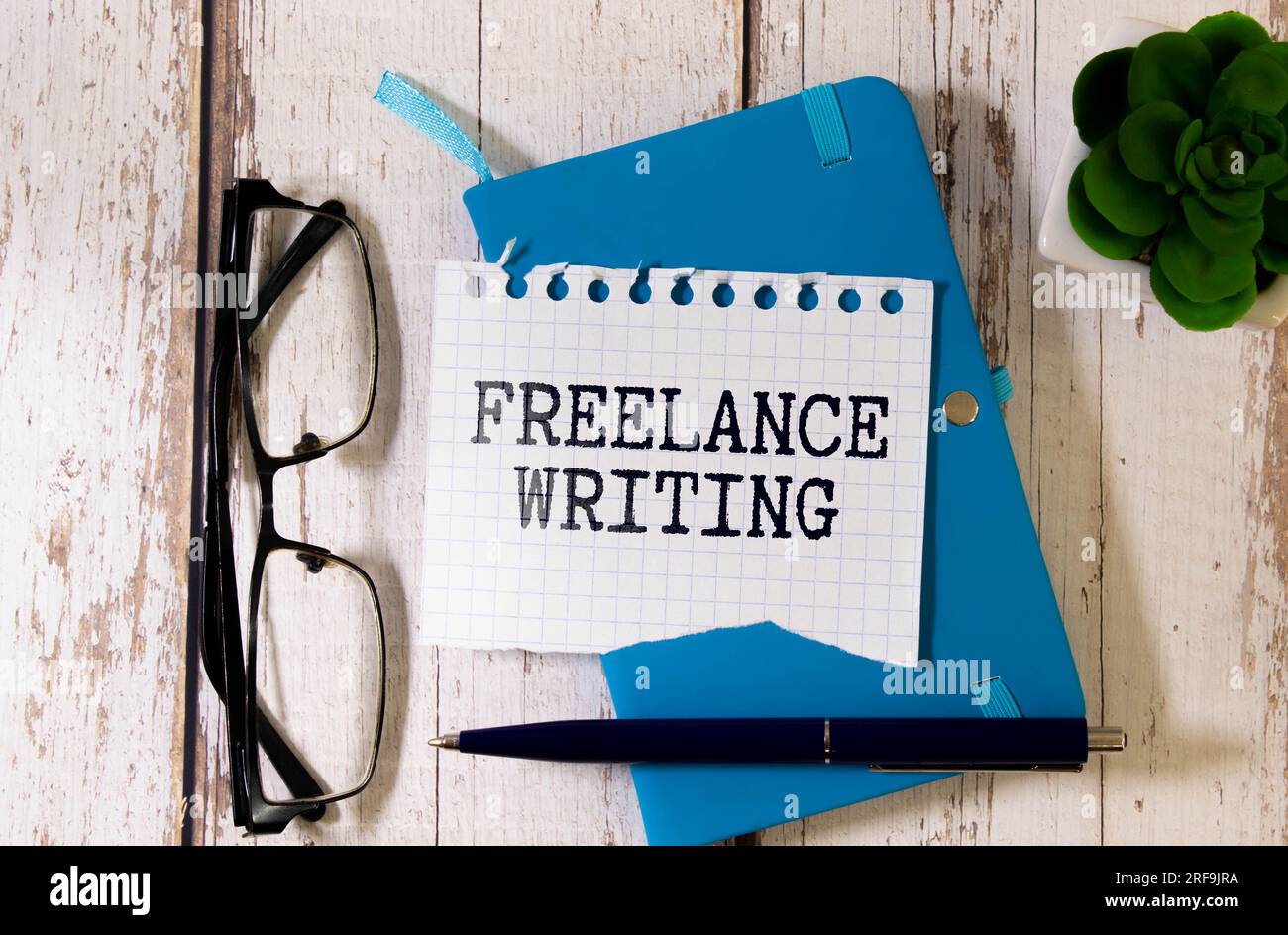 White card with the text FREELANCE WRITING on office desk Stock Photo ...