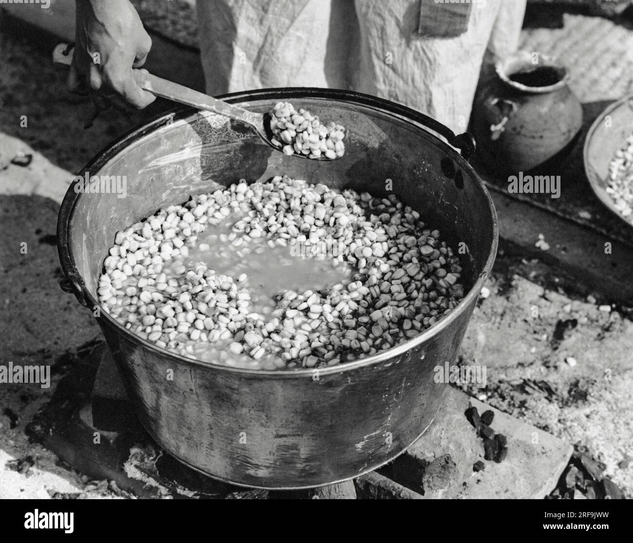 California: c. 1930 Native American women cooking corn to make ...