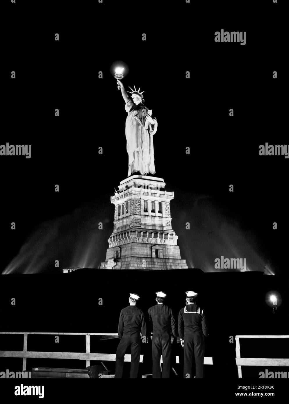 New York, New York: May 8, 1945 Three sailors gaze up on V-E Day at the ...