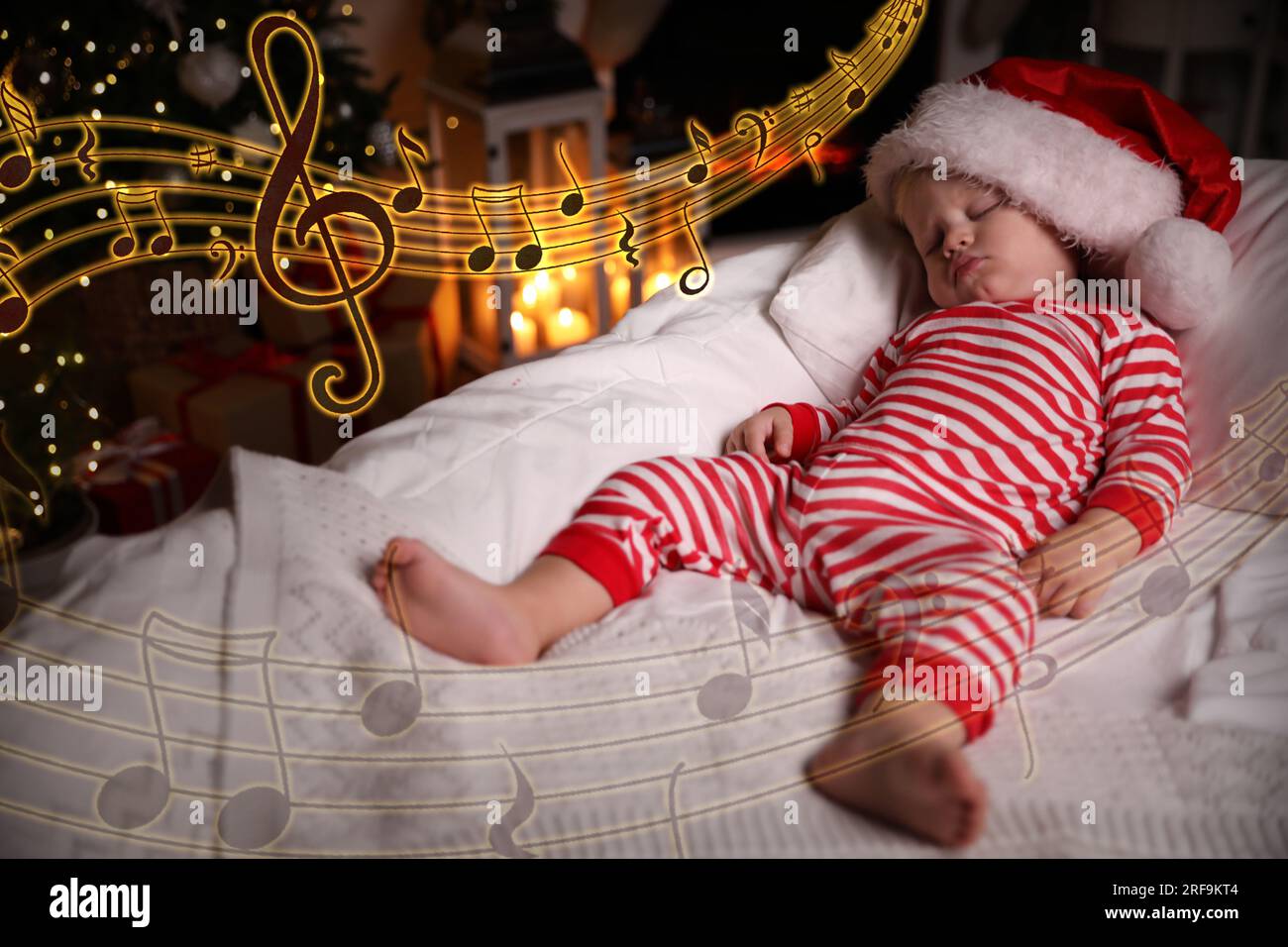 Lullaby songs. Cute little baby in Santa hat sleeping at home ...