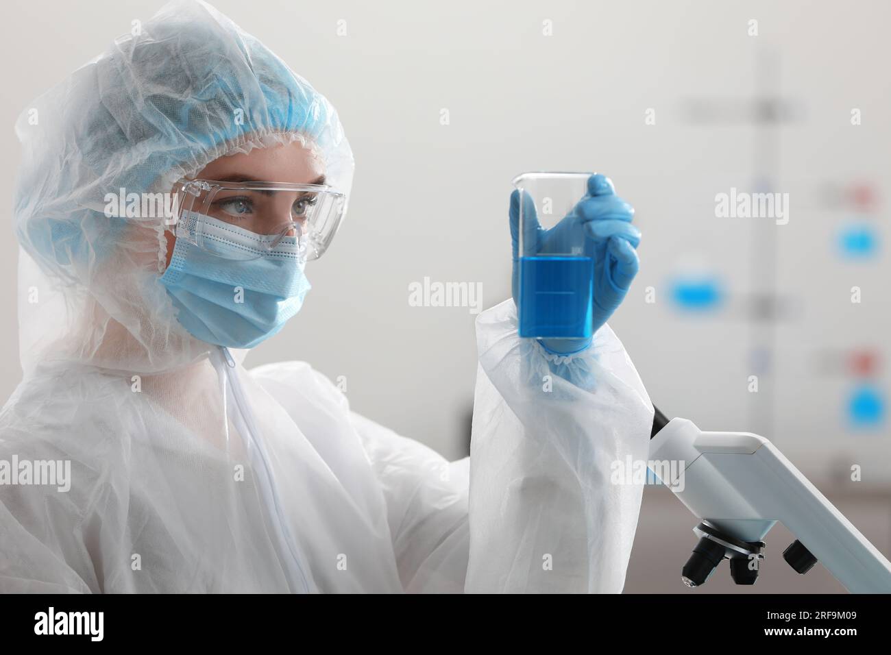 Scientist holding beaker hi-res stock photography and images - Alamy