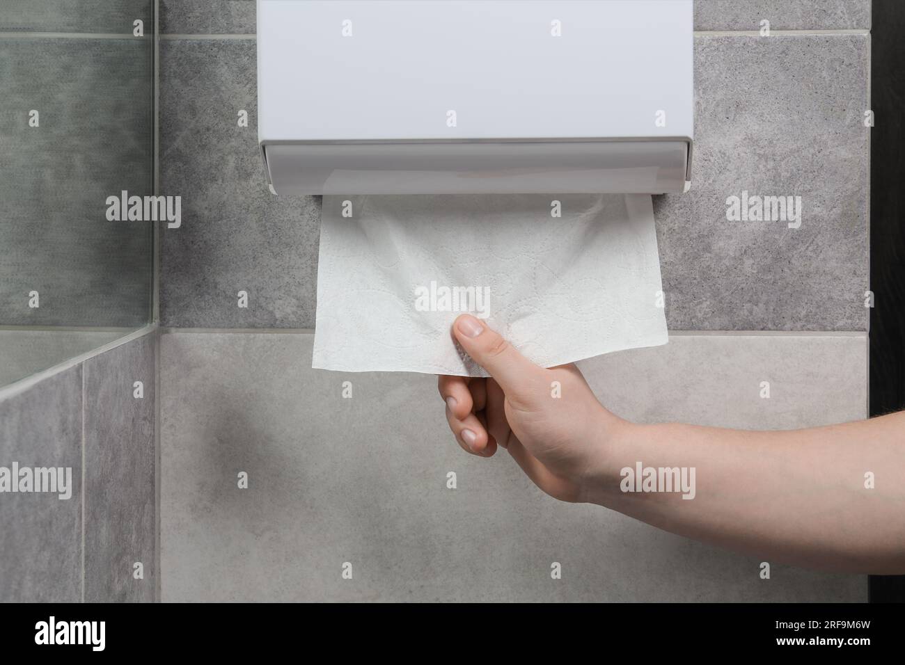 Woman taking soft towel from hi-res stock photography and images - Alamy