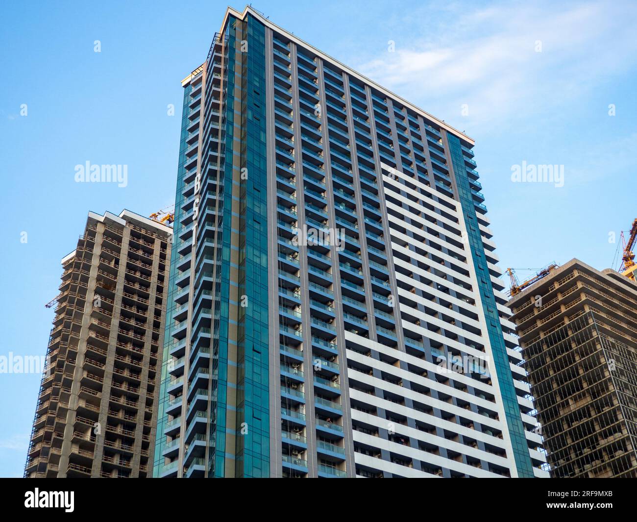 Construction of modern high-rise buildings. Looking up. Unfinished ...