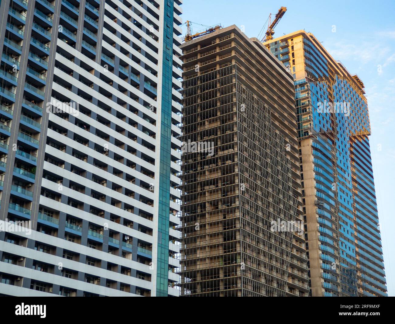 Construction of modern high-rise buildings. Looking up. Unfinished ...