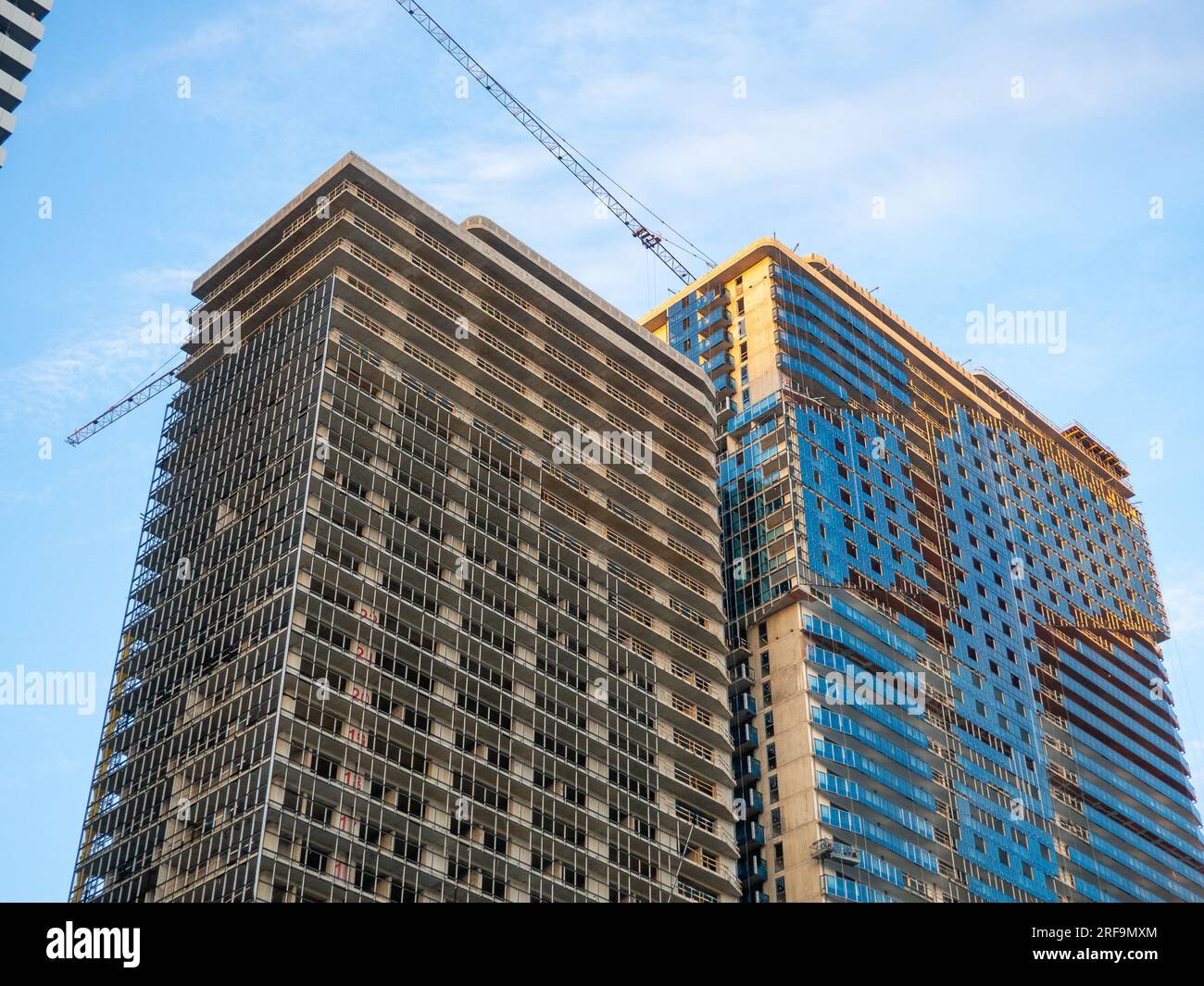 Construction of modern high-rise buildings. Looking up. Unfinished ...