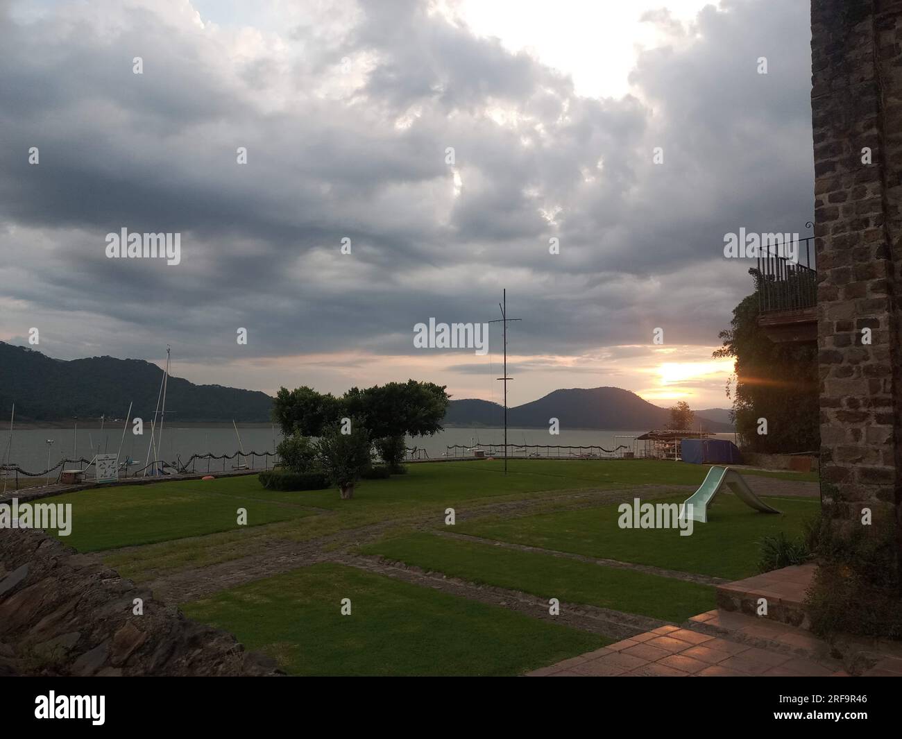 Port of small and large sailboats parked and sailing on the lake of ...