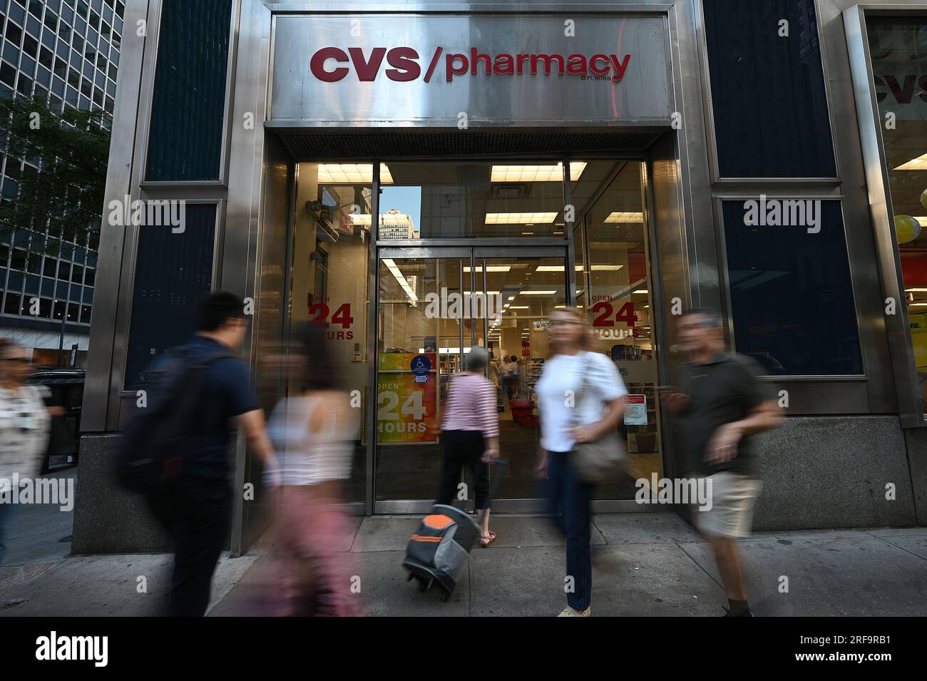 New York, USA. 01st Aug, 2023. People walk past the entrance to a CVS Pharmacy retail store n ...