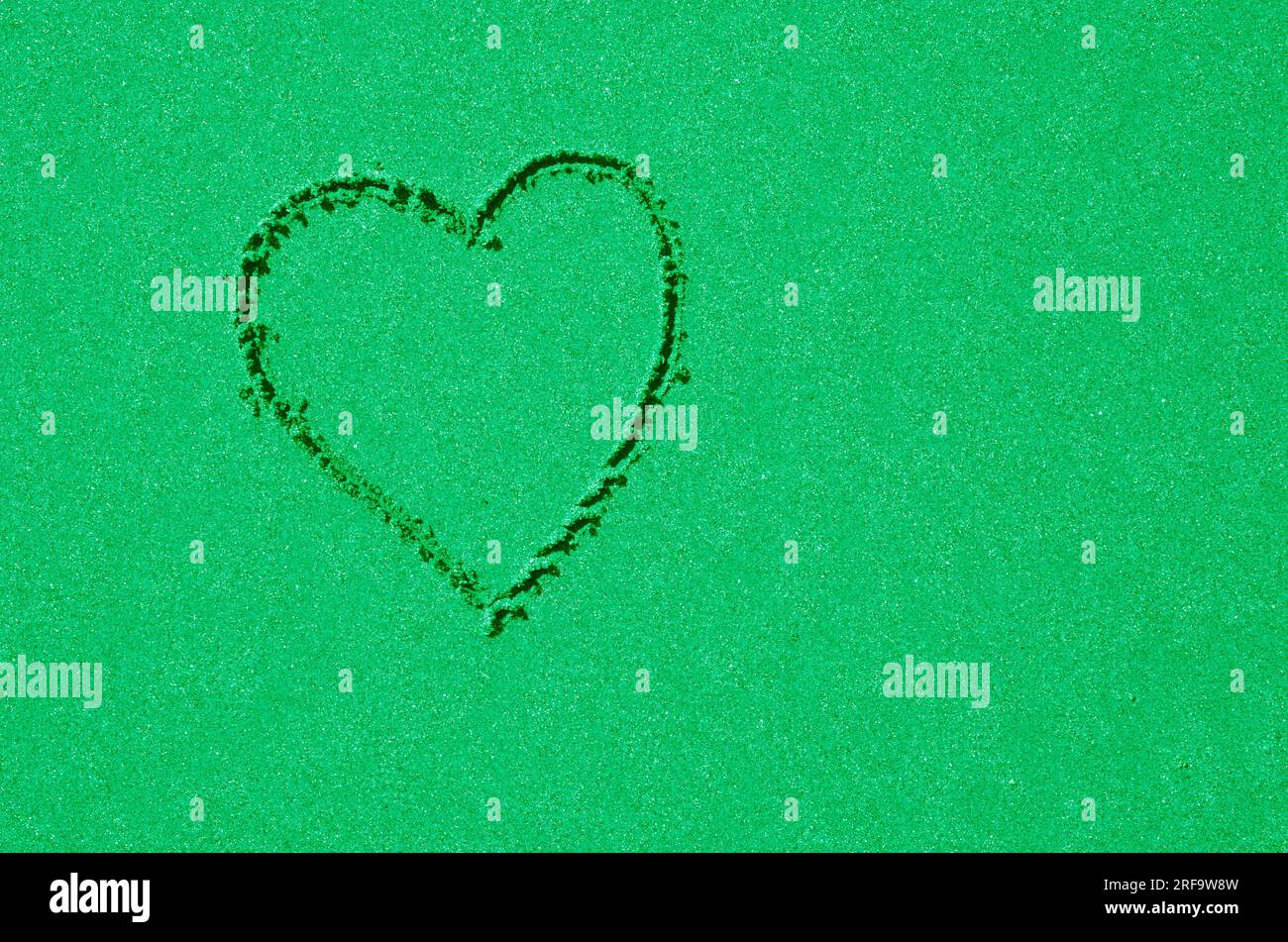 Bright green heart in clean sparkling background. Love or romance in ...