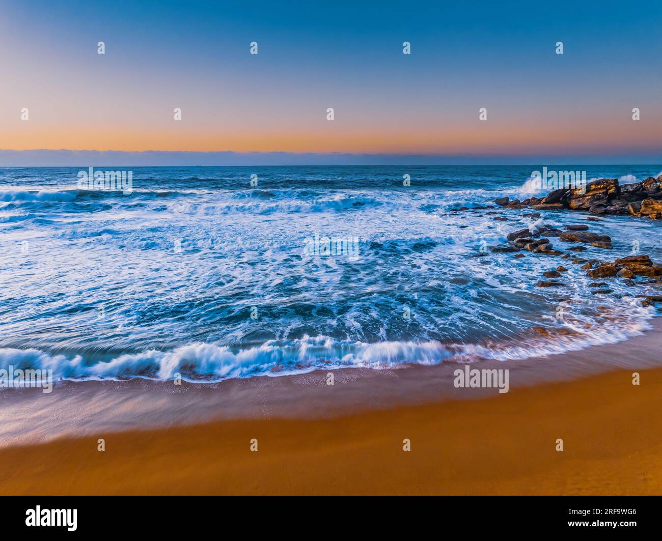 Aerial sunrise seascape with good size waves at Killcare Beach on the ...