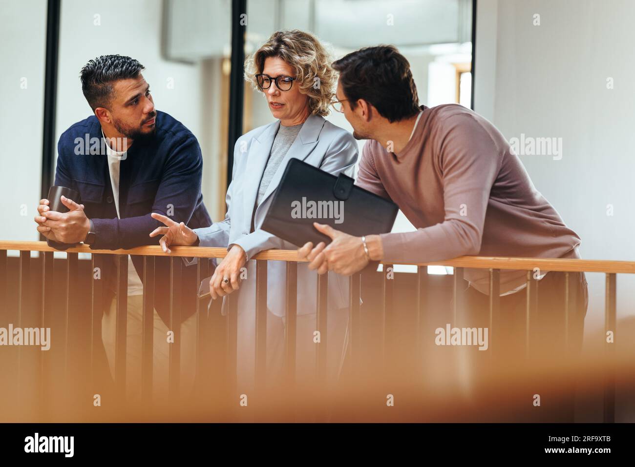 business woman talks to her colleagues about a project in an office ...