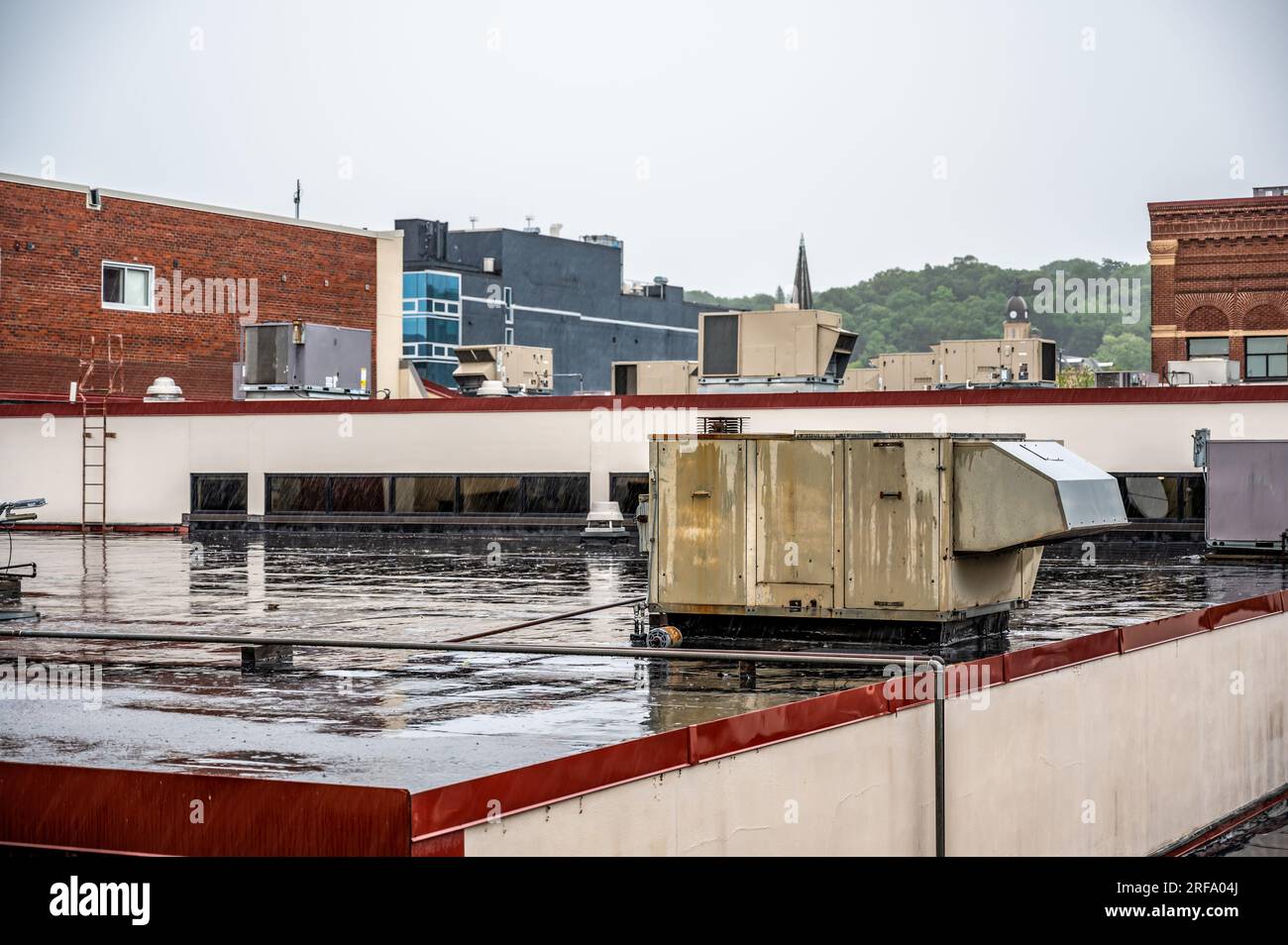 Rooftop industrial air handler during a rain storm Stock Photo - Alamy