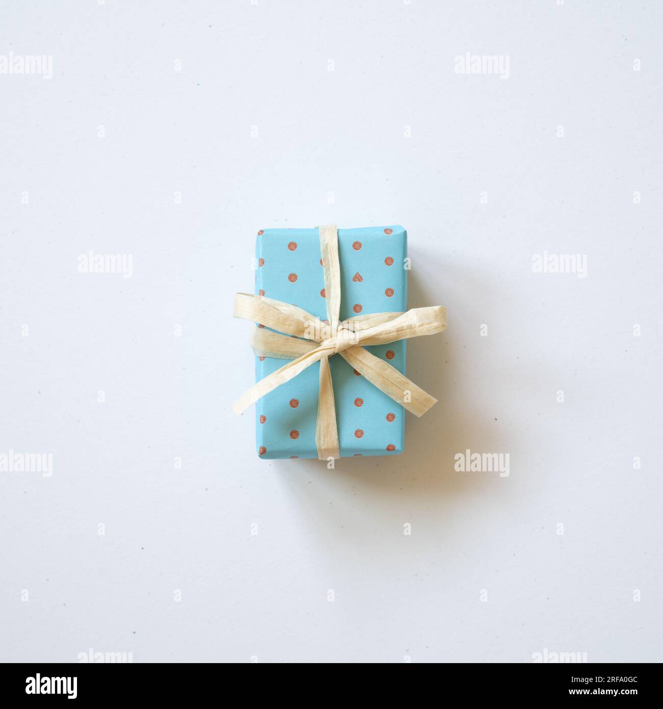 Sky blue dot pattern gift box isolated on white background. top view ...