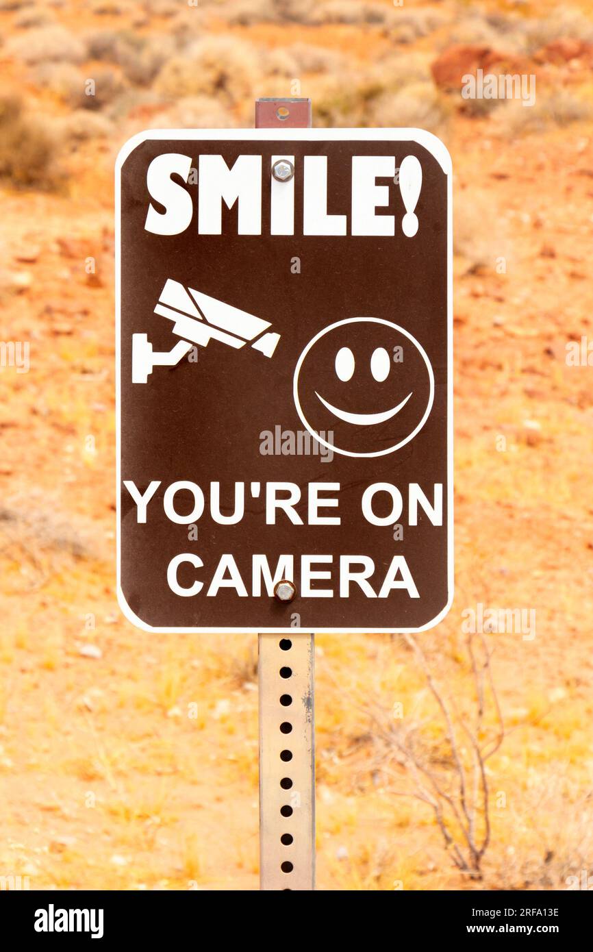 brown sign warning of security cameras at car park in valley of fire ...