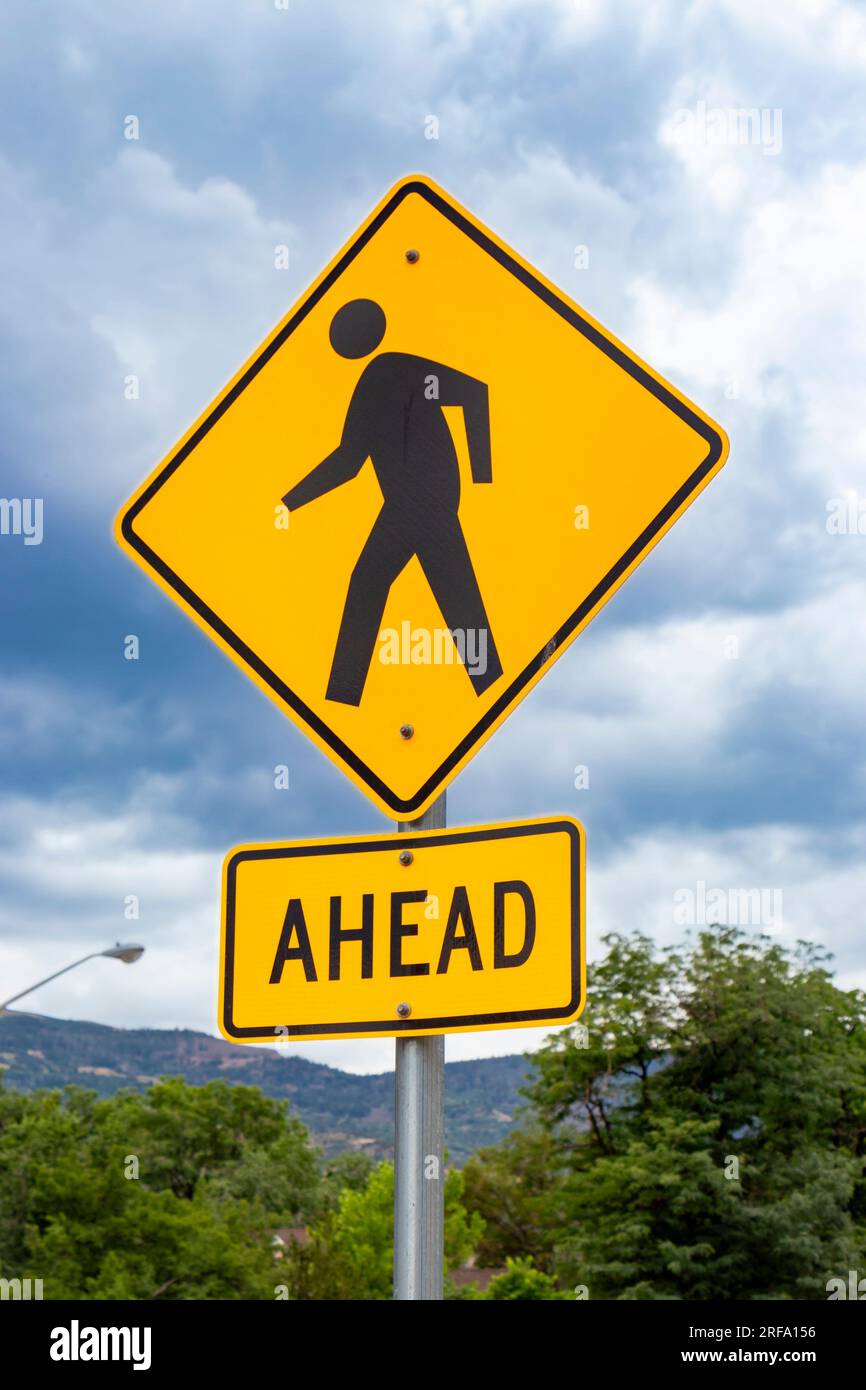Pedestrians in road ahead sign hi-res stock photography and images - Alamy
