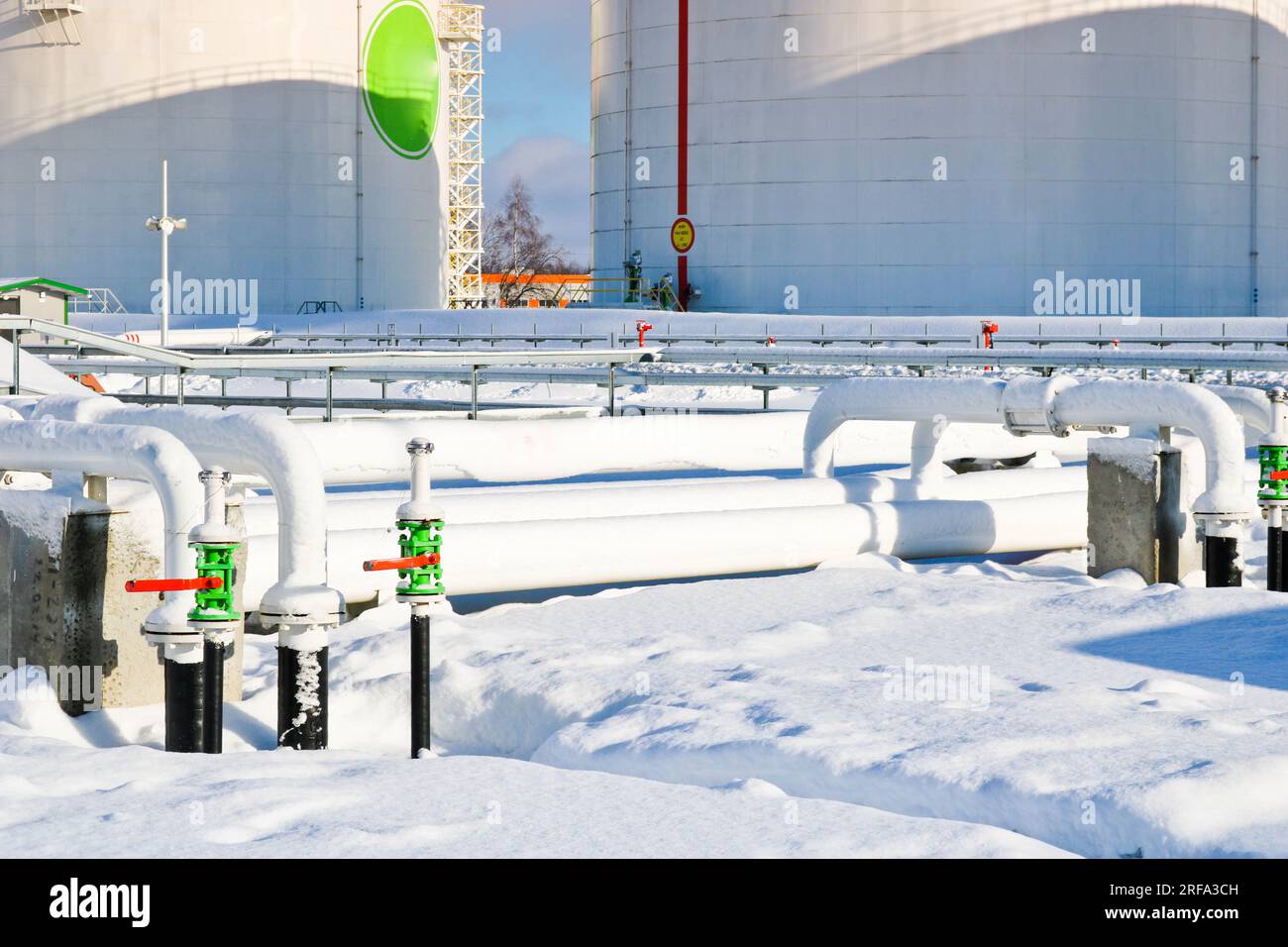 Large white iron metal industrial tanks for storage of fuel, gasoline ...