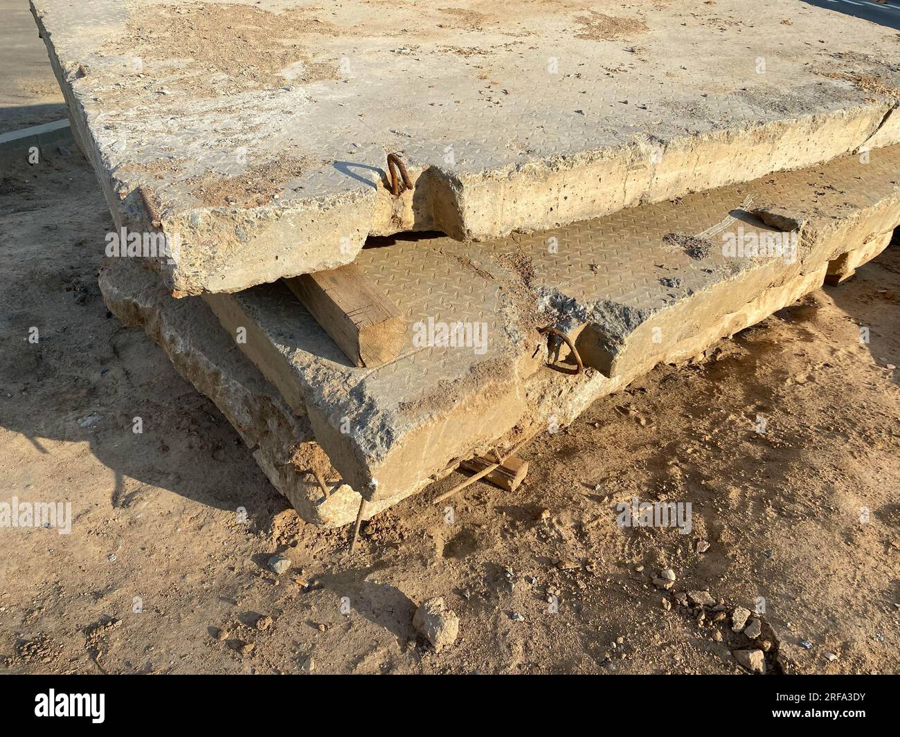 iron white slabs lie horizontally one on top of the other. construction ...