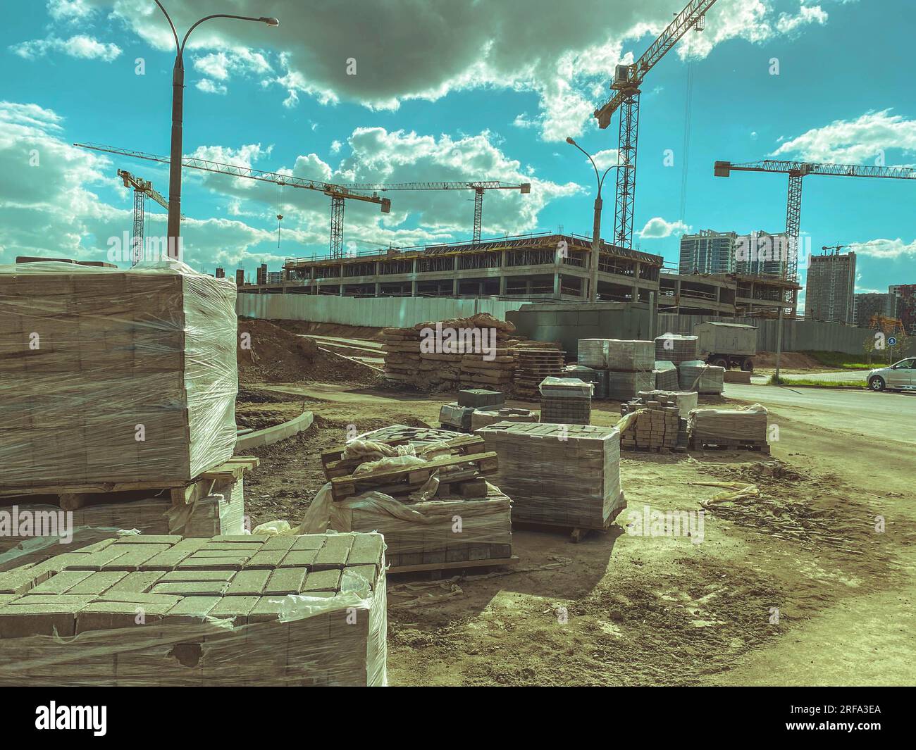 construction of a shopping center. building walls from blocks using a ...