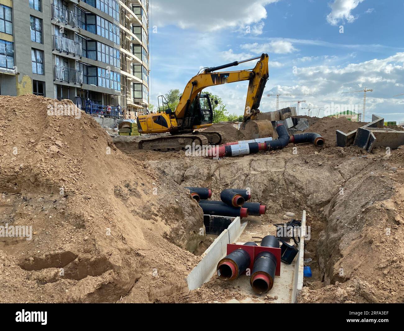 Powerful yellow industrial professional excavator doing earthwork ...