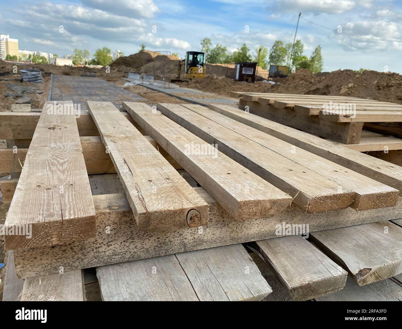 Many pallets stacked in stock, warehouse pallets, blue wooden pallets ...
