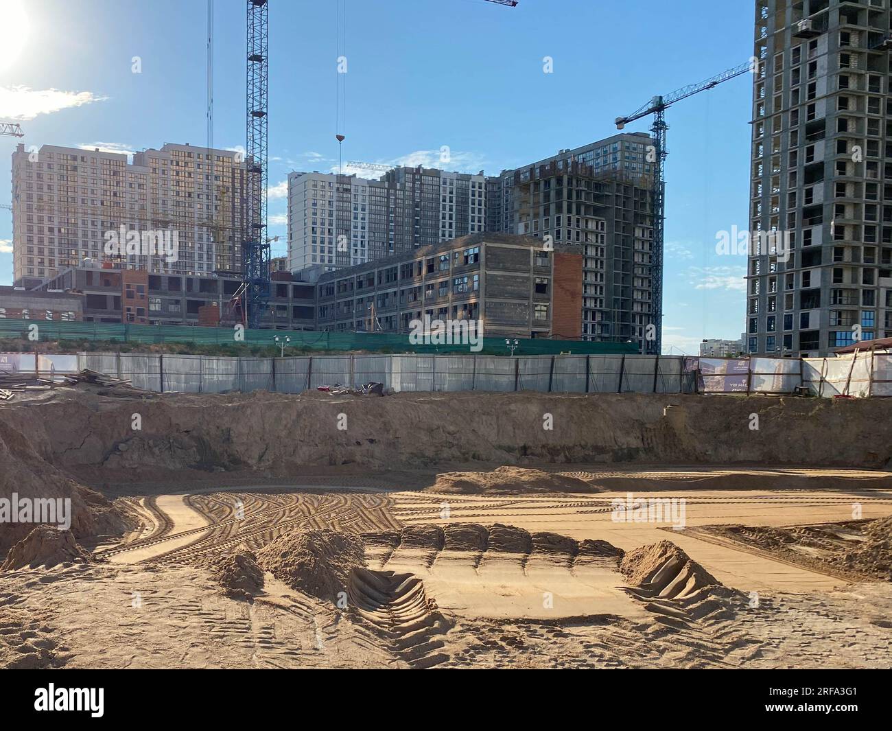 Tall concrete houses are being built in the city center. multi-storey ...