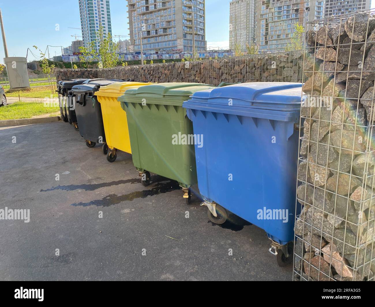 Black, yellow, green and blue plastic large modern containers for ...
