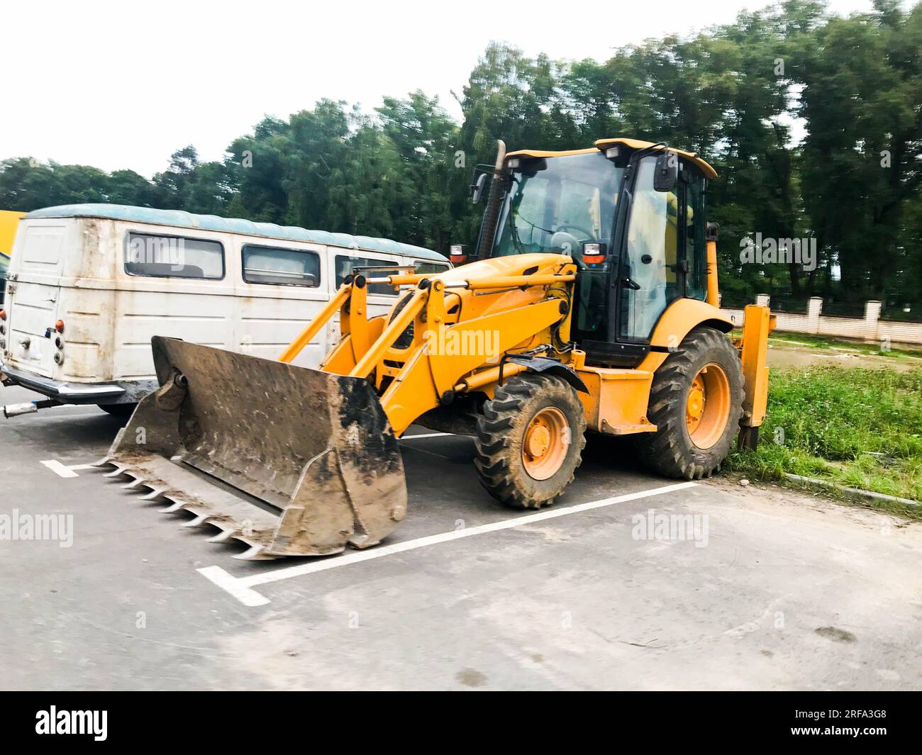 Big powerful iron orange excavator construction with a metal bucket ...
