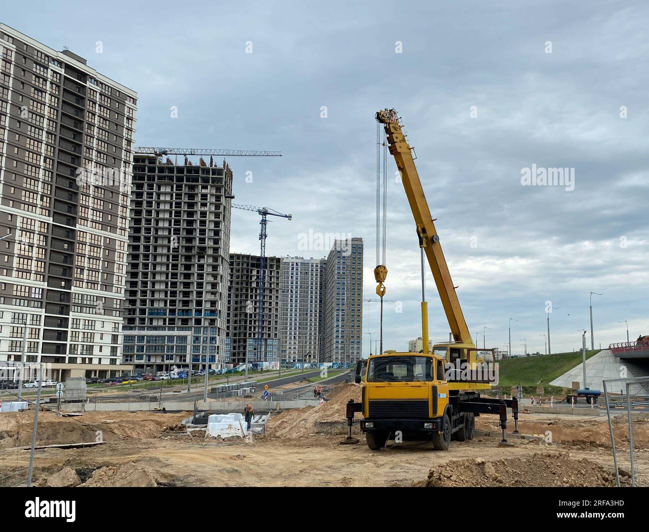 Large yellow mobility modern industrial construction crane mounted on a ...