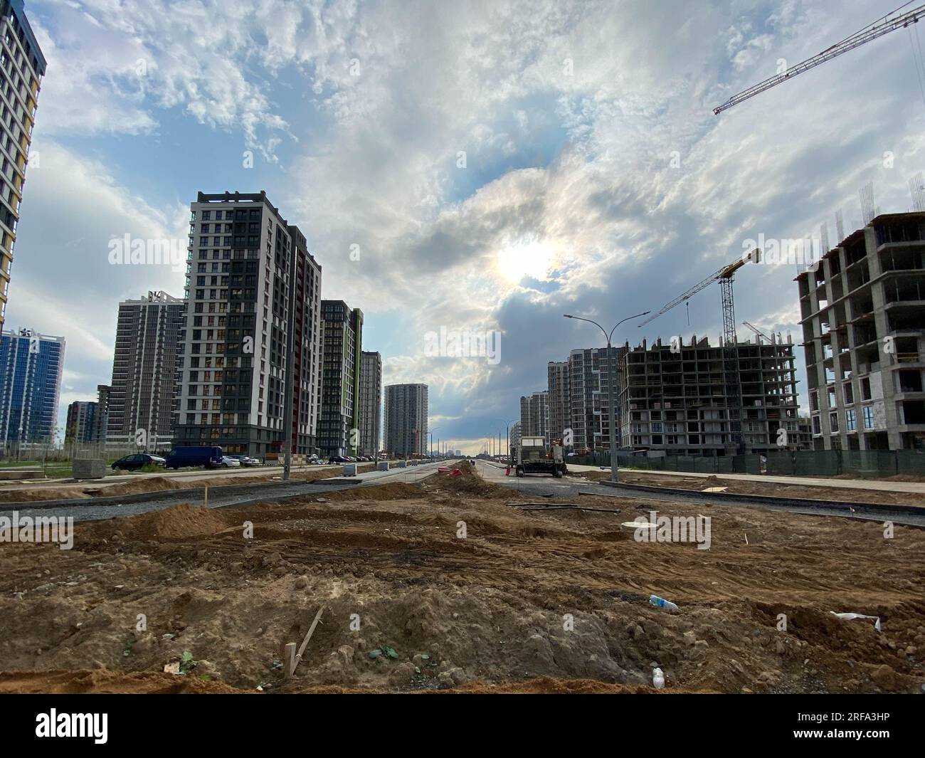 Construction of a wide high road in a new microdistrict of a large city ...