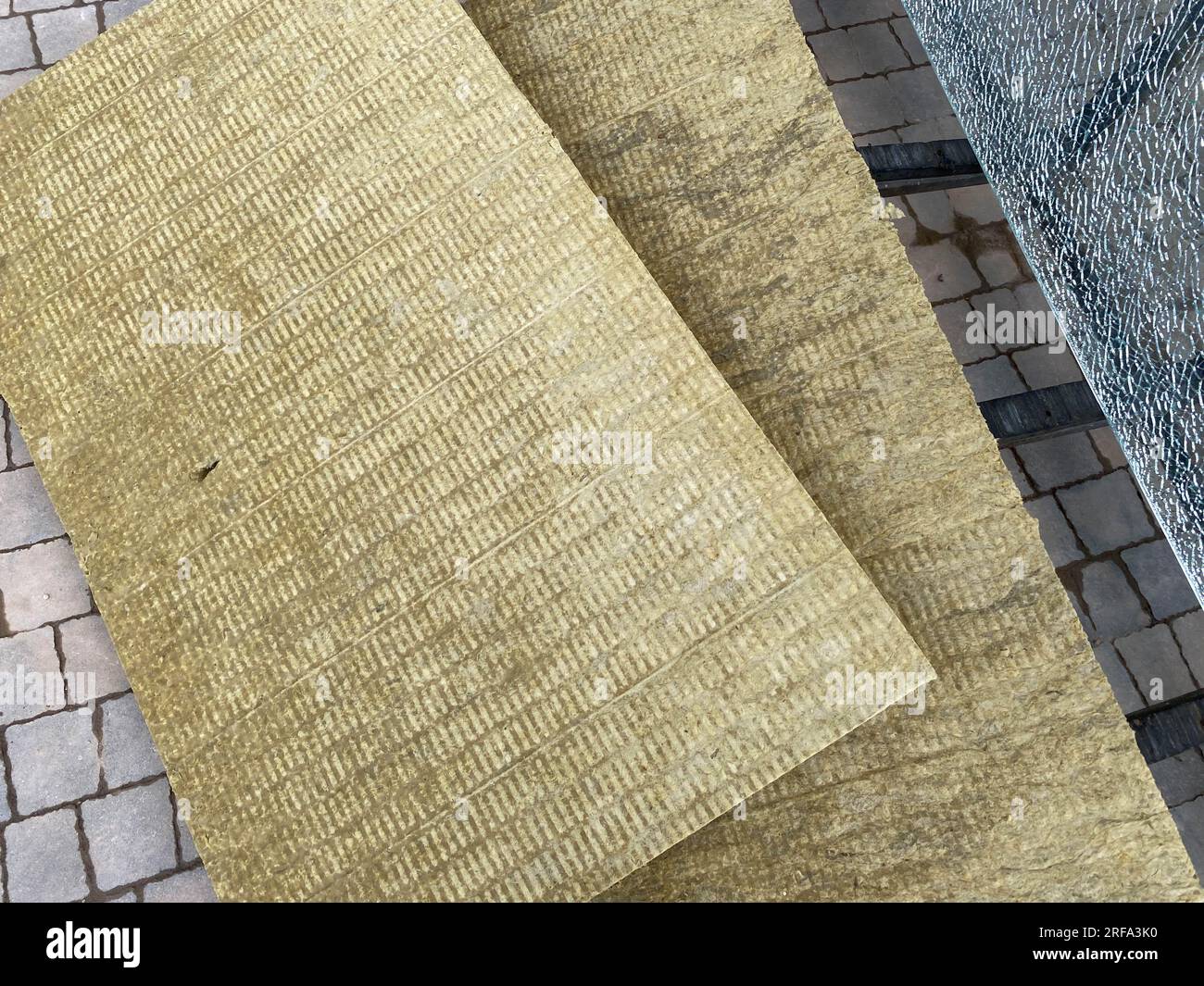 A piece of yellow building industrial insulation for house facades ...