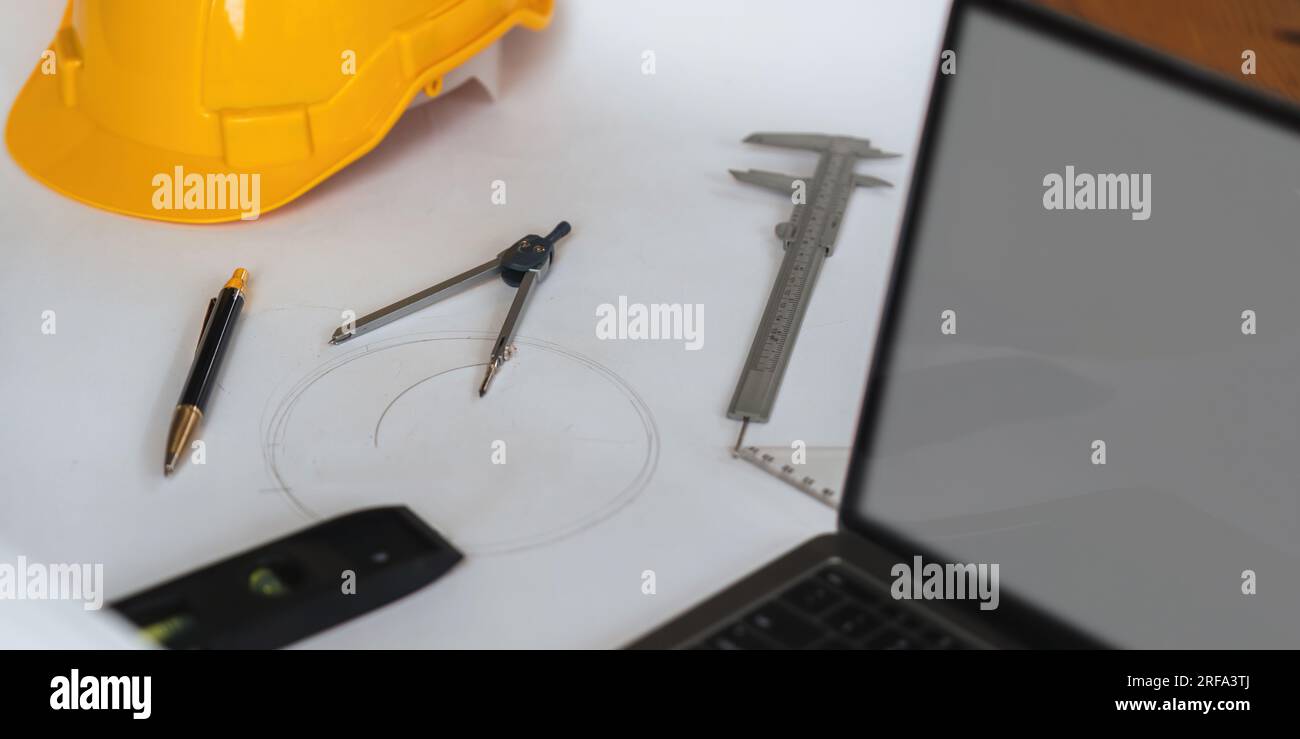 Engineer workplace with blueprints, compass, pen, construction level ...