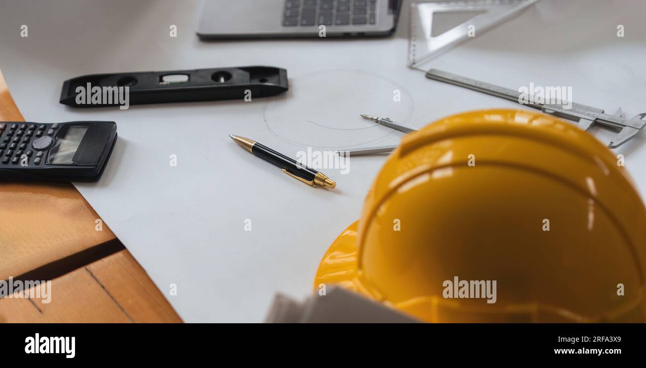 Engineer workplace with blueprint, compass, pen, construction level and ...