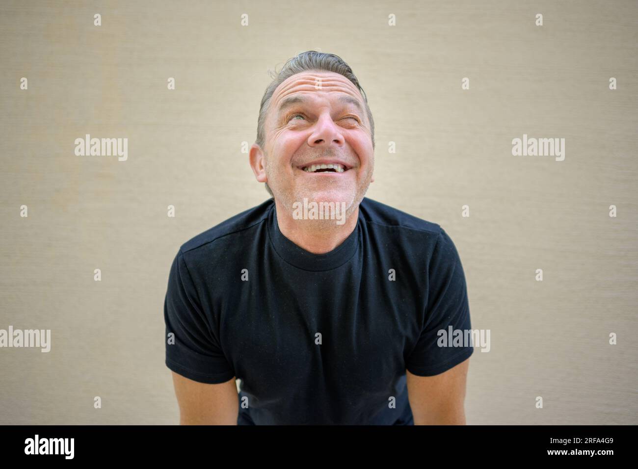 Man leaning towards camera hi-res stock photography and images - Alamy