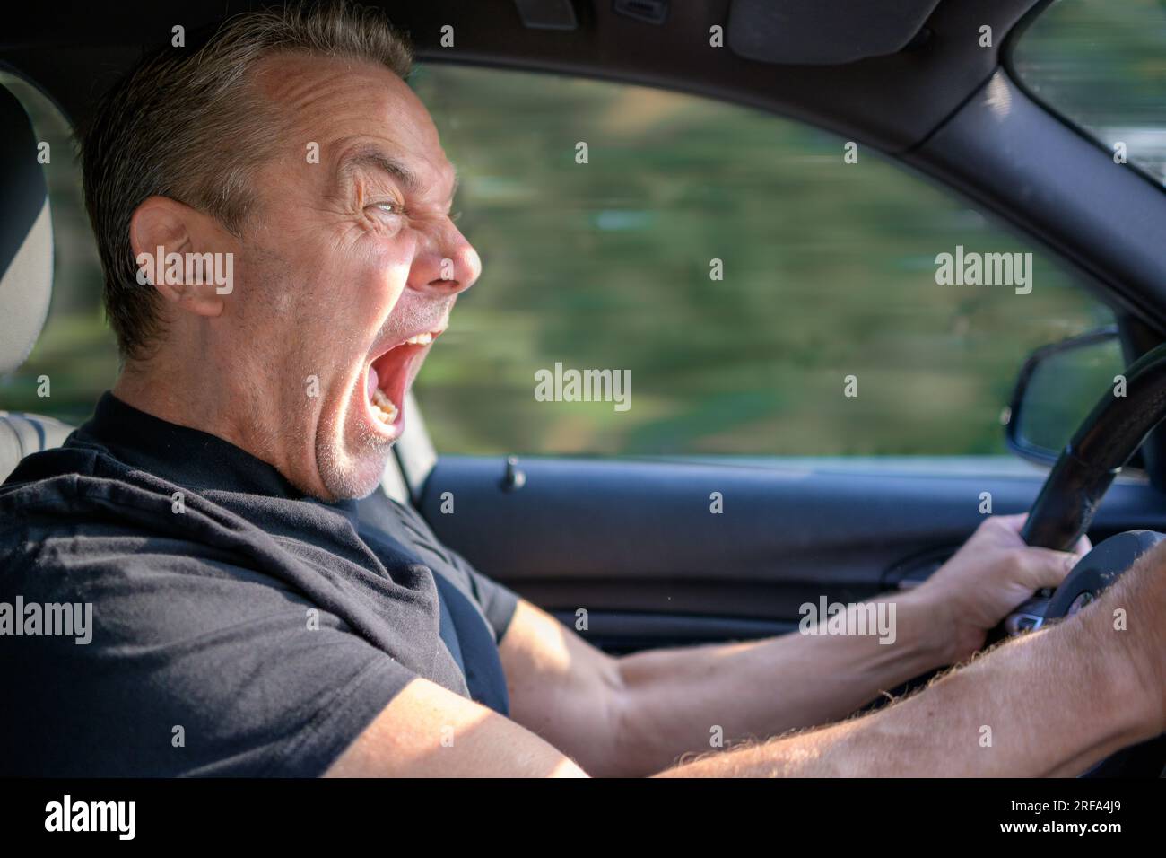 Shocked frightened man screaming and braking just before an accident ...