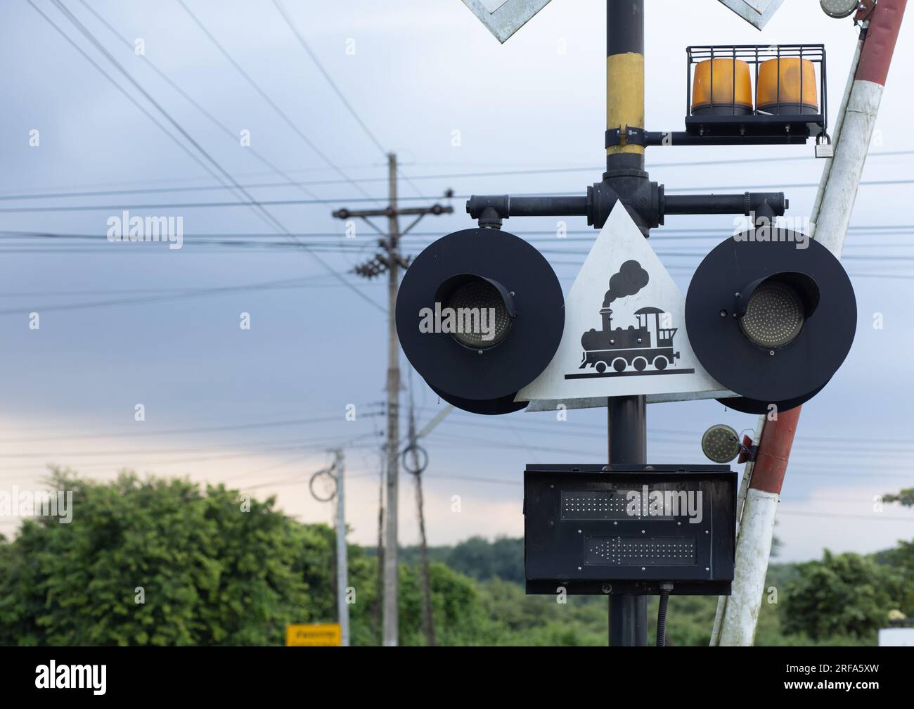 Railway crossing warning signs and train signs Stock Photo - Alamy