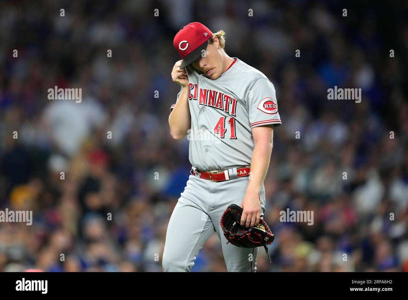 Cincinnati Reds starting pitcher Andrew Abbott wipes his face after ...