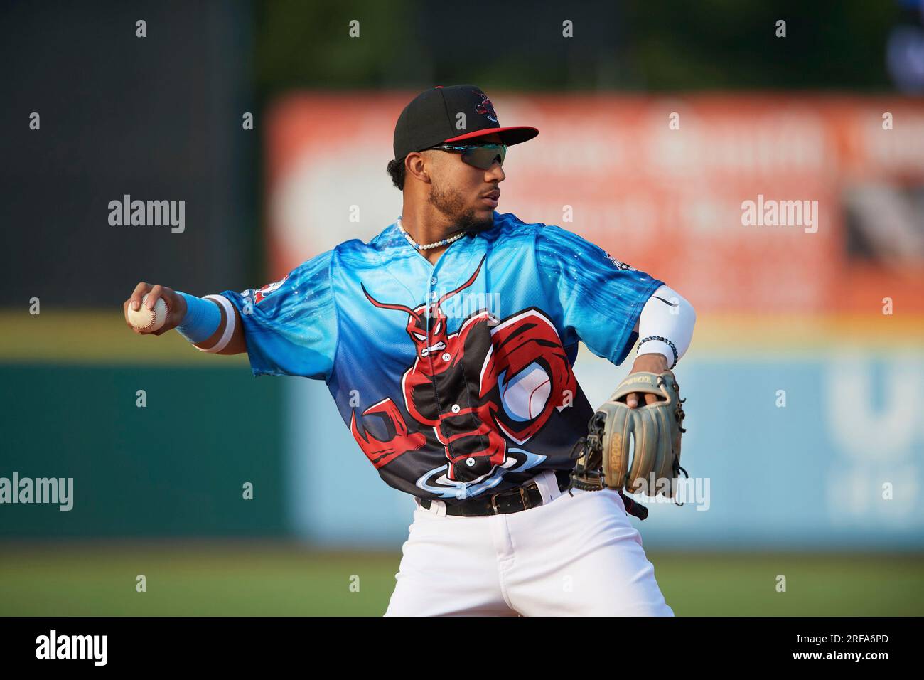 Hickory Crawdads shortstop Max Acosta (23) throws during a South ...