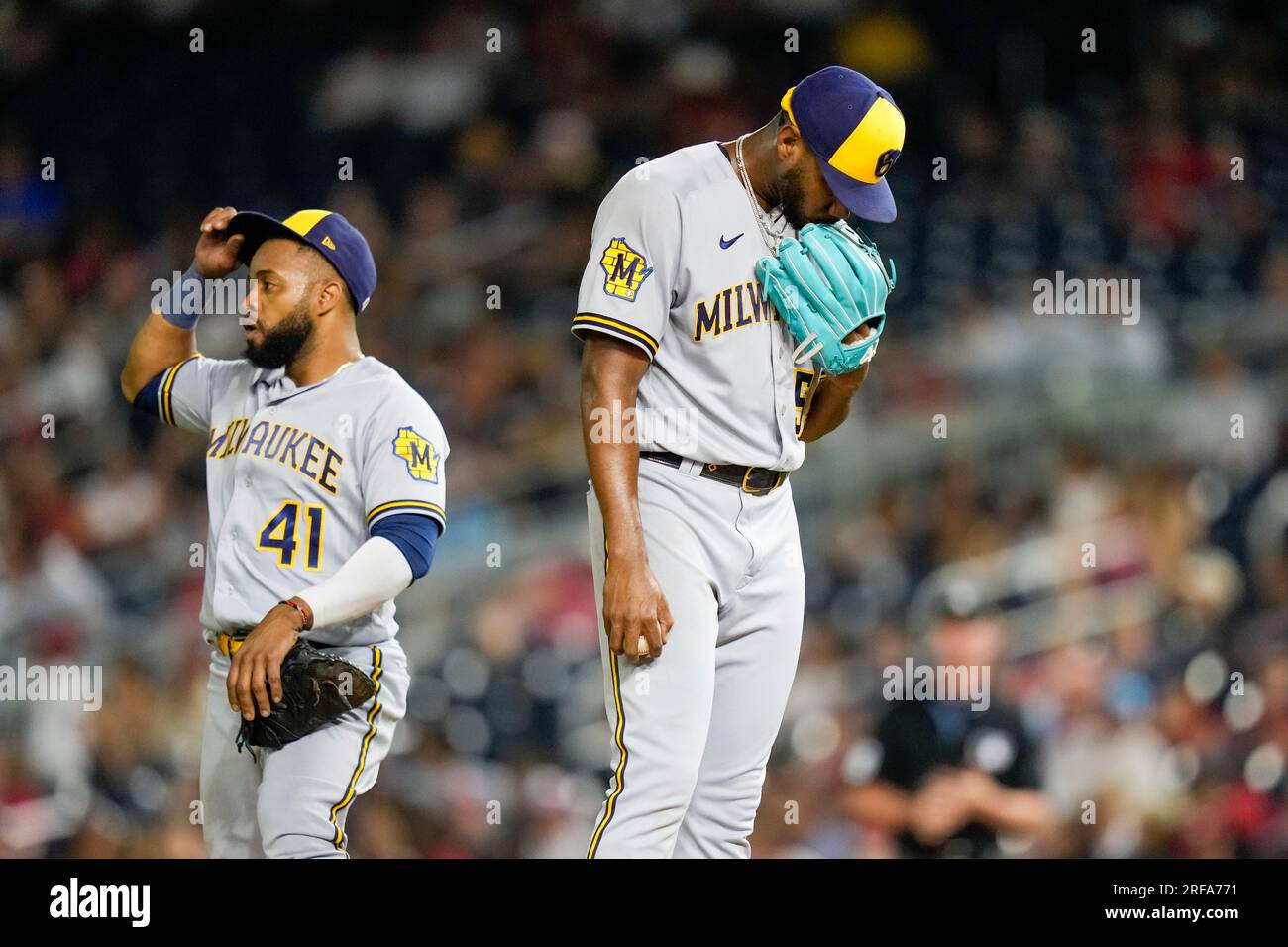 Milwaukee Brewers first baseman Carlos Santana (41) reacts near relief ...